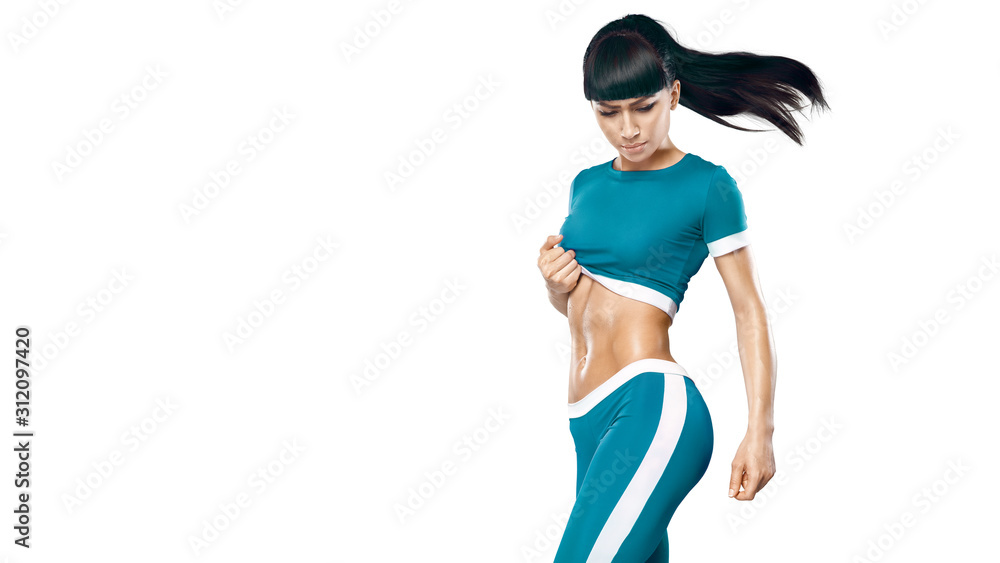 Fitness athletic young woman in bright sportswear showing her well ...