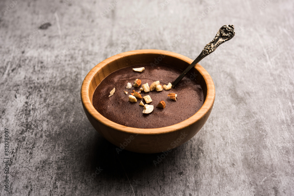 Sweet Ragi Malt / Healthy Ragi Porridge in a bowl garnished with ...