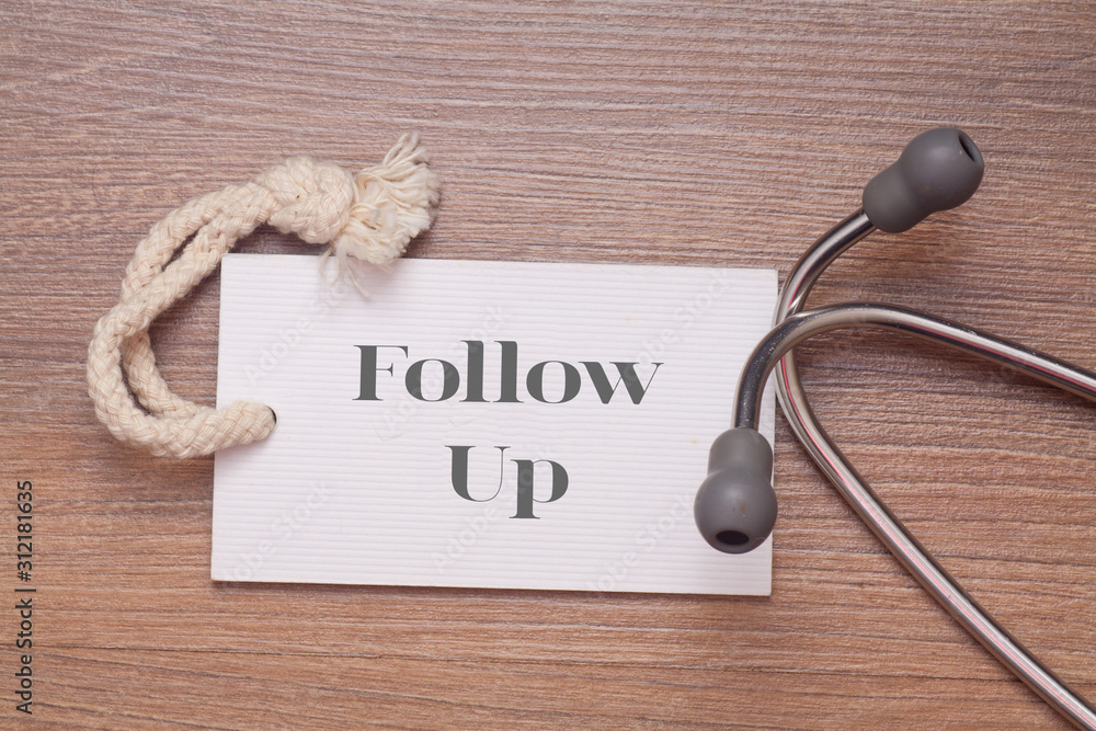 Medical Concept : The words follow up written on price tag label with ...