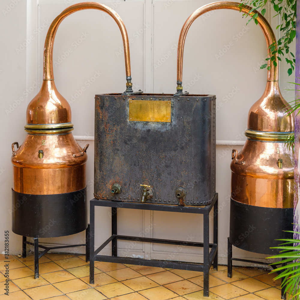 Ancient distillation cube with two bronze flasks Stock Photo | Adobe Stock