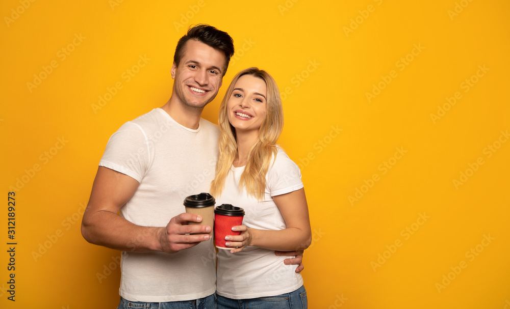 Our coffee break. A good-looking couple in casual outfit is posing ...