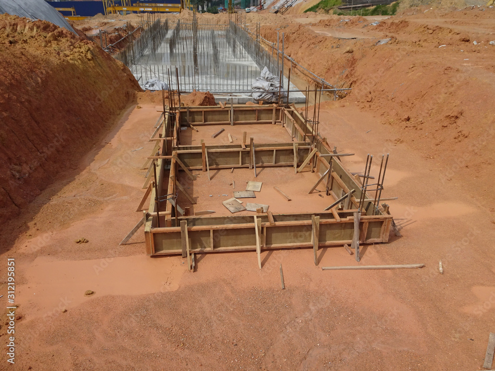 Building ground beam under construction using temporary timber plywood ...