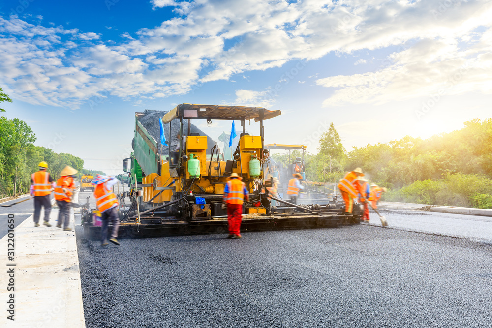 Construction site is laying new asphalt road pavement,road construction ...