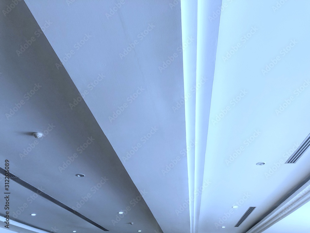 White ceiling with neon lights in the office. White ceiling can reflect ...