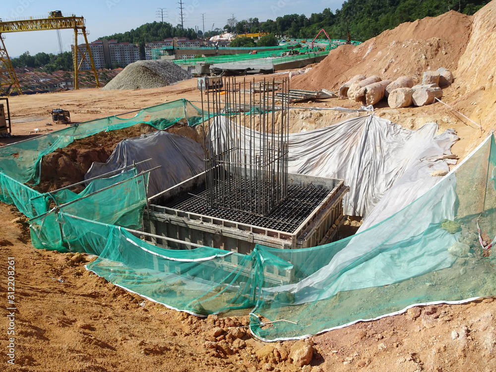 Pile cap and column stump under construction at the construction site ...