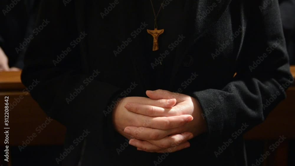 Praying hands of christian woman praying in Cathedral. Catholic nun ...