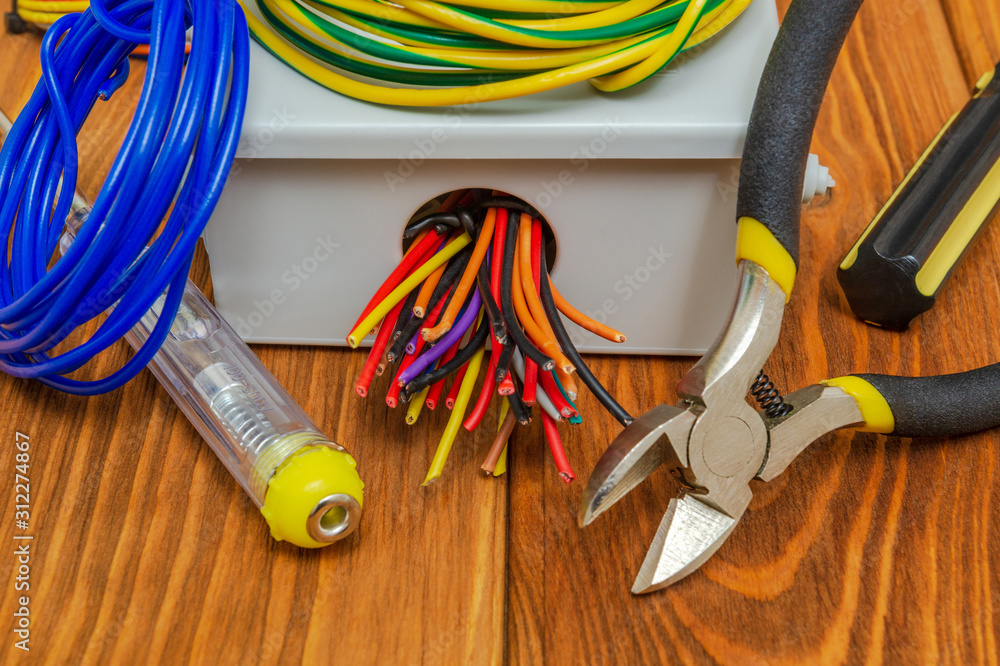 Electrical junction box with cables wire and tools used in the electric ...