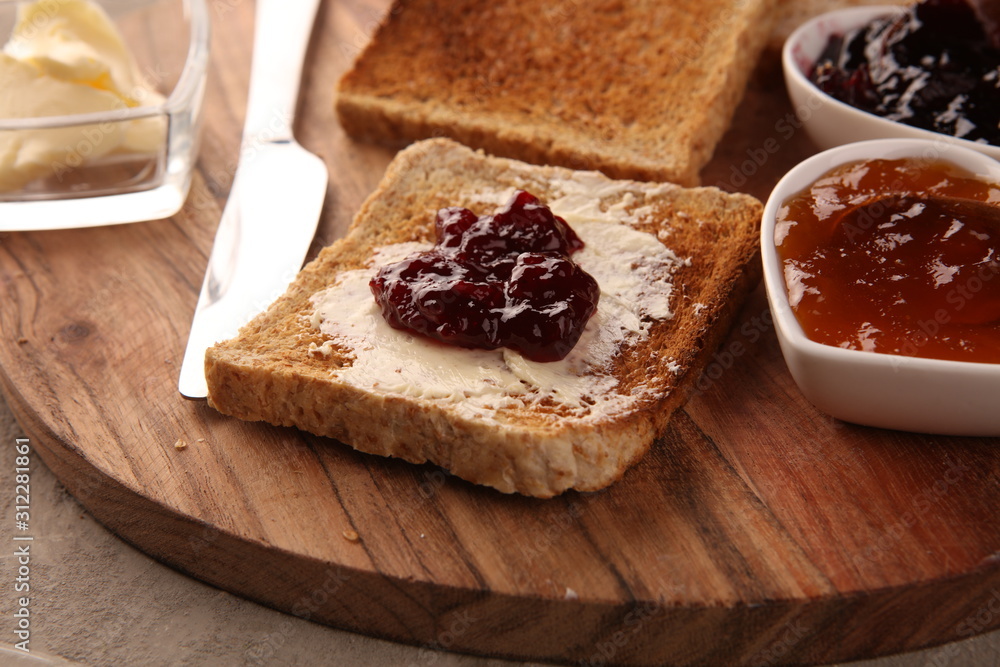 Toast bread with homemade strawberry jam and apricot marmalade on ...