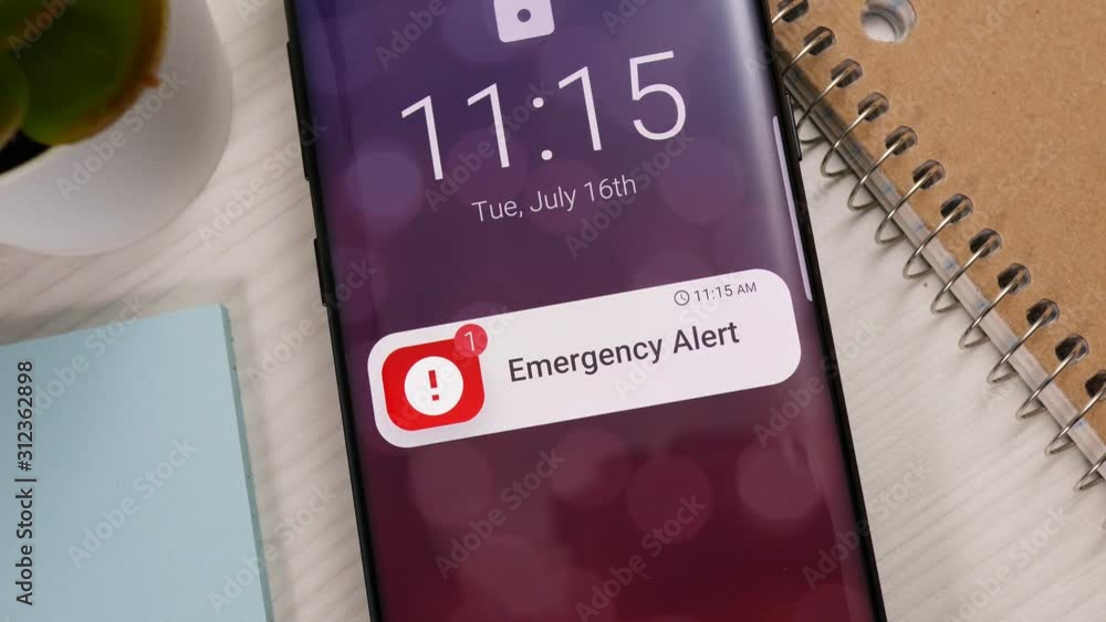 Smartphone showing an emergency notification banner appearing on the ...