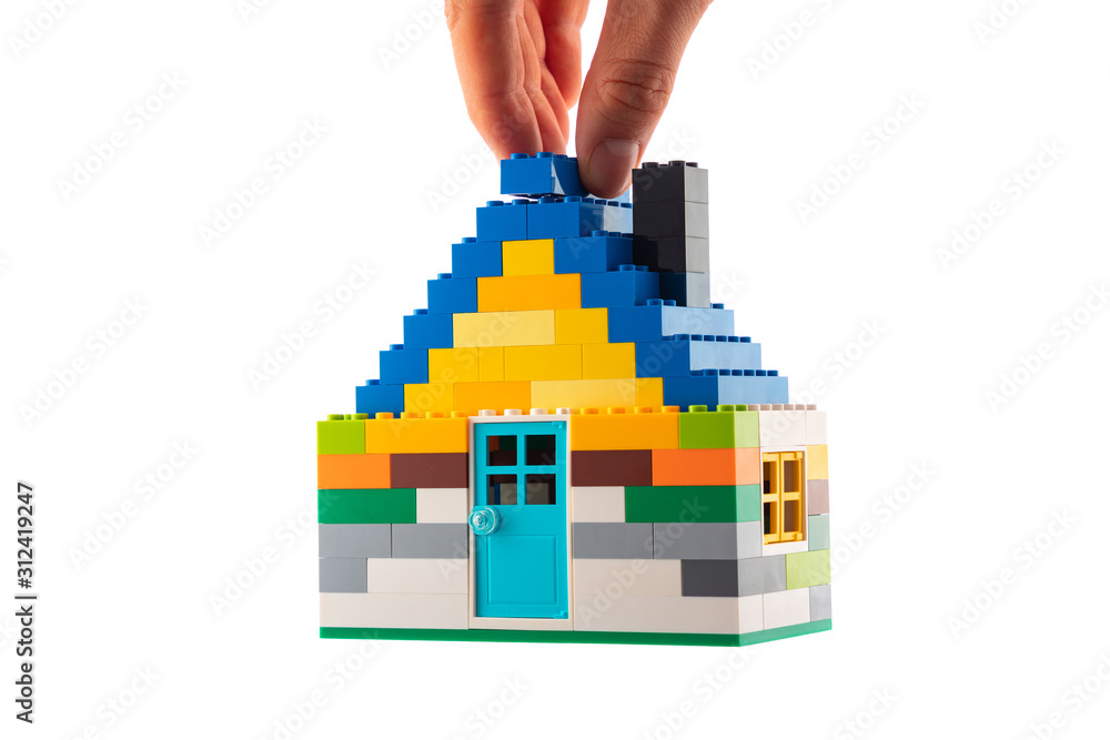 House made of classic building blocks, white studio background. Stock ...