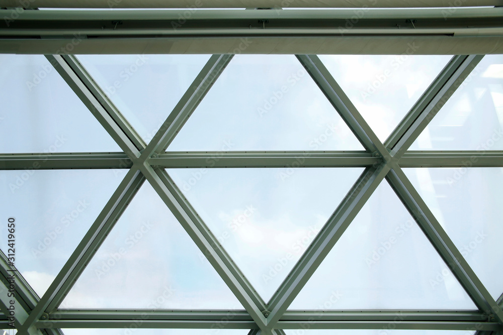 Transparent ceiling with triangular glass units. Structural glazing ...
