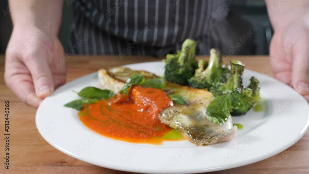 Restaurant food concept. chef presenting his food plate in kitchen ...