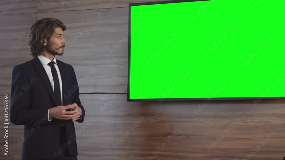 Business meeting, a young businessman speak at a meeting and shows a ...