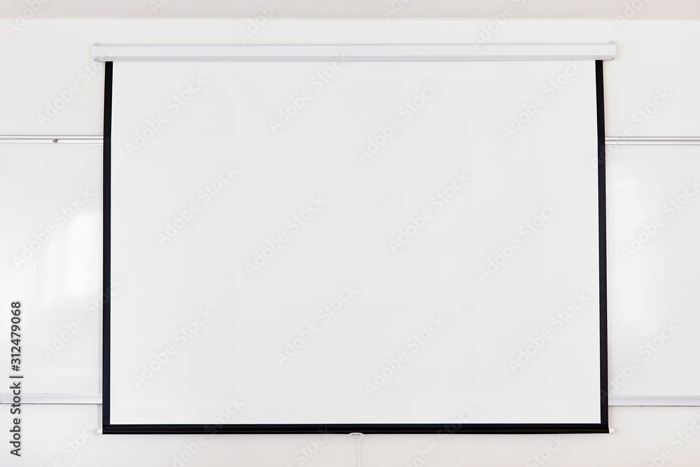 White projection screen over a white board on the classroom wall Stock ...
