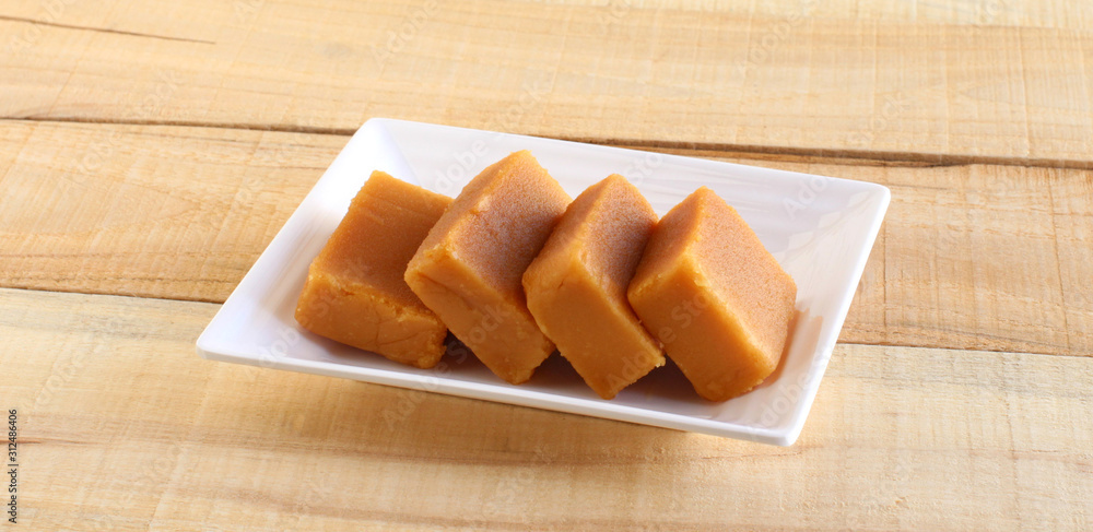 Mysore pak, a traditional, popular, and delicious sweet dish native to ...