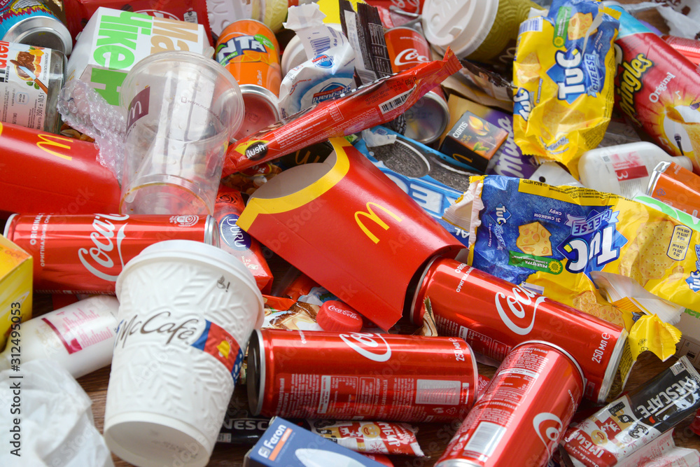 Big pile of many disposable colored trash from edible products of ...