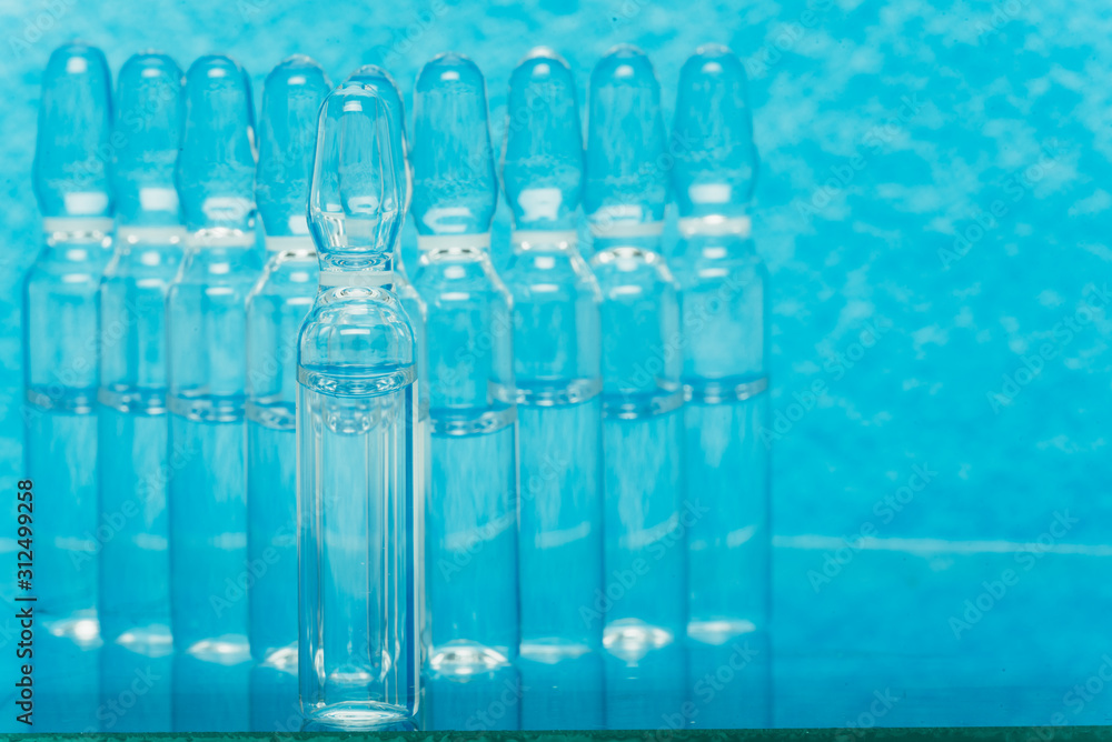 Glass medical ampoule vial for injection. Medicine is liquid sodium ...