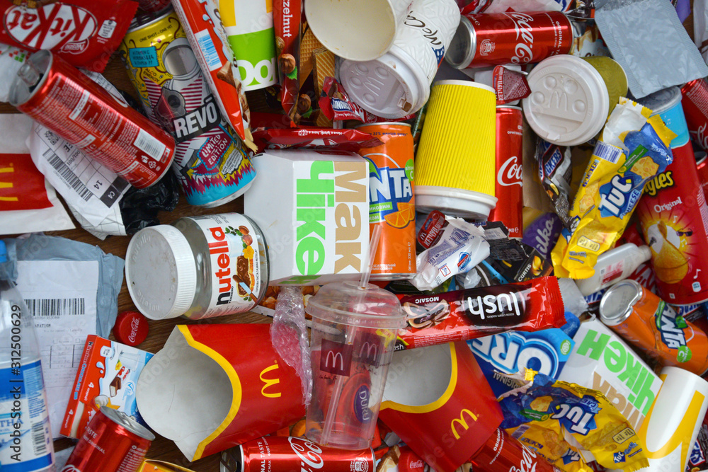 Big pile of many disposable colored trash from edible products of ...