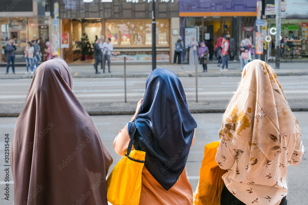 Three muslim women or girls wearing hardscarf / hijab Stock Photo ...