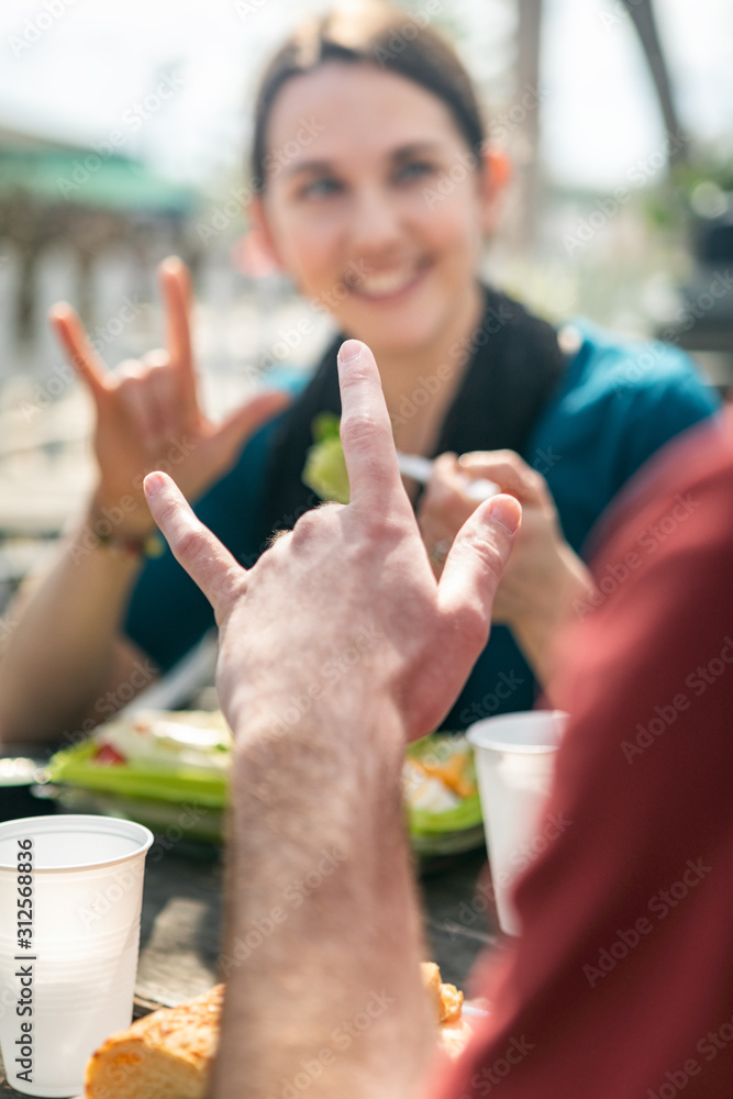 ASL: Friends Sign ""I Love You"" To Each Other Stock Photo | Adobe Stock
