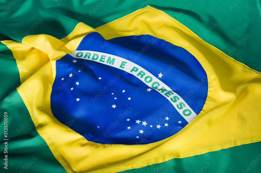 Foto de Close view of a waving colorful Brazilian flag do Stock | Adobe ...