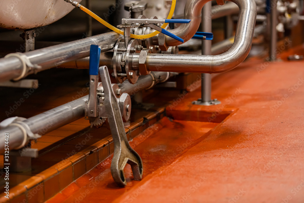 stainless steel metallic pipes and fittings selective focus, Centric ...