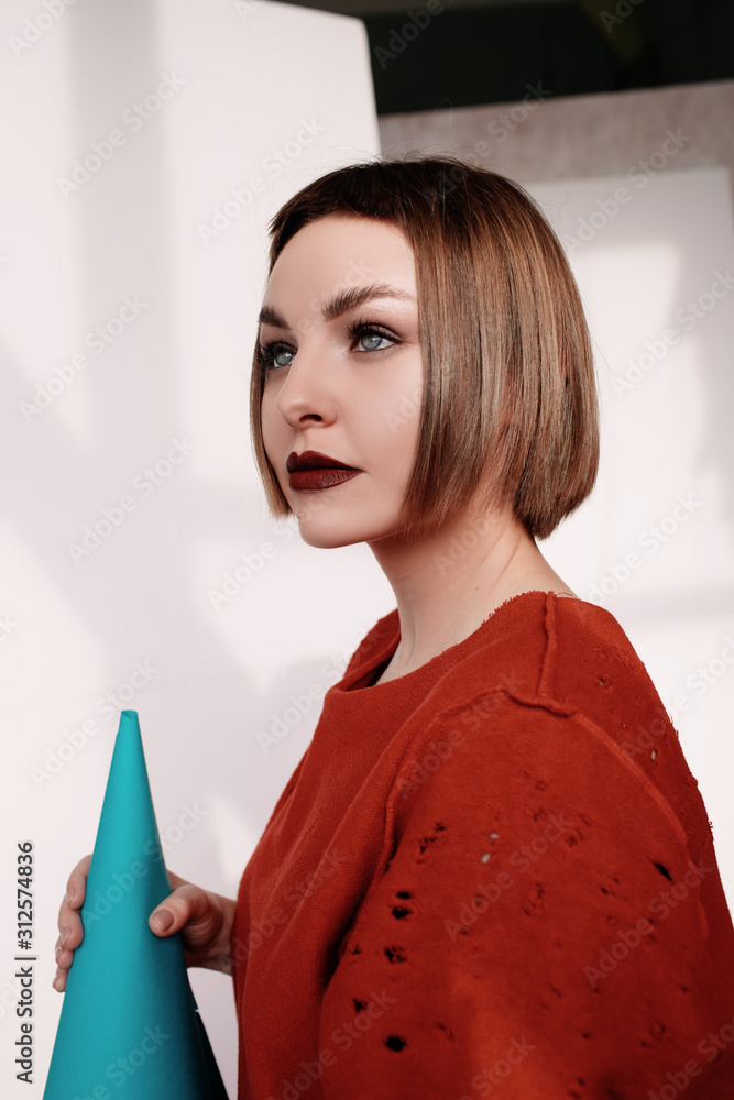 Attractive female with paper cone Stock Photo | Adobe Stock