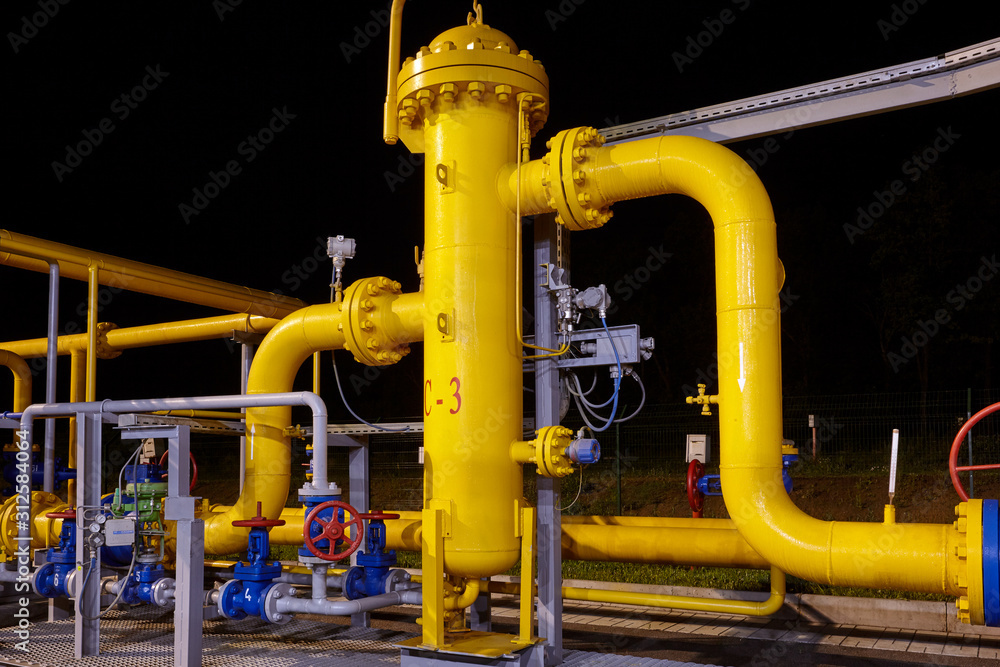 Pipeline system at a gas production and processing plant. Pipes, valves ...