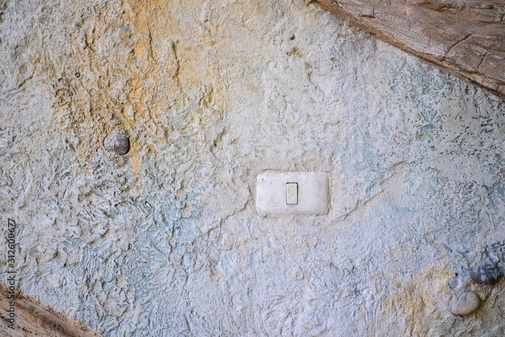 White light switch on the wall. "On" and "Off" switch. Light switch on ...