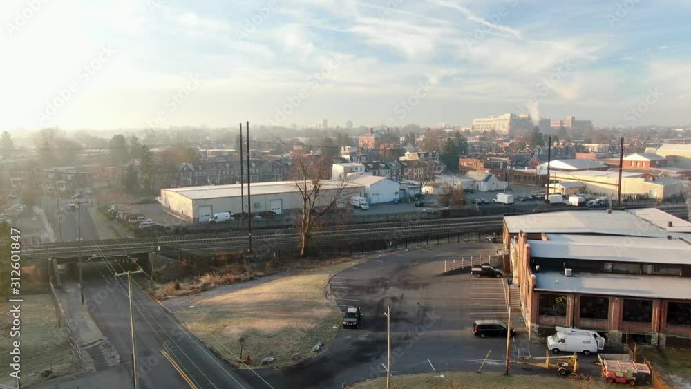 Aerial establishing shot, urban setting on cold winter morning in ...