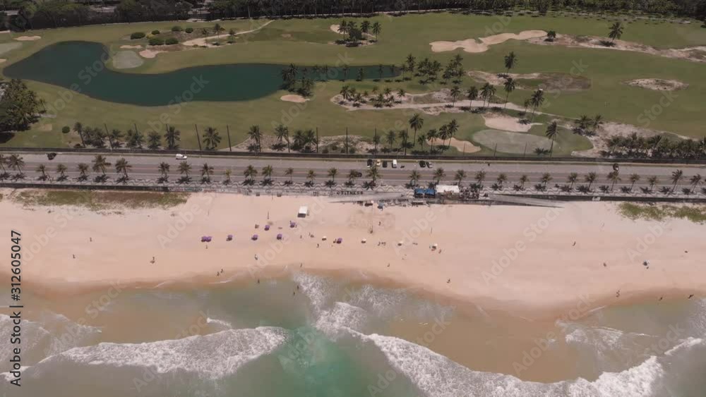 Aerial backward movement showing the green of the Gavea golf course ...