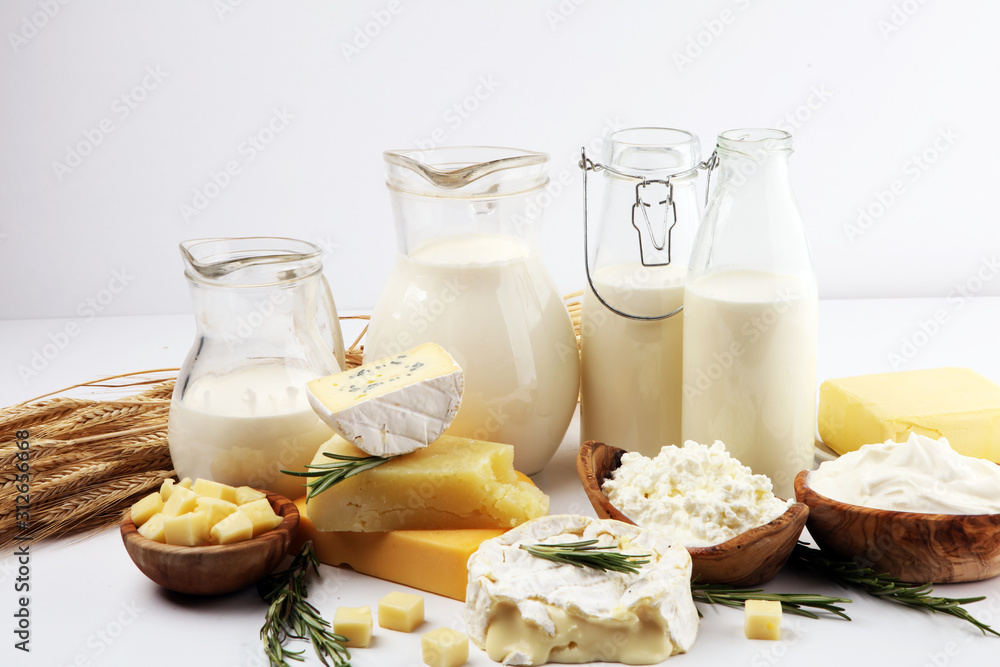 Different healthy dairy products on rustic background with milk, cheese ...
