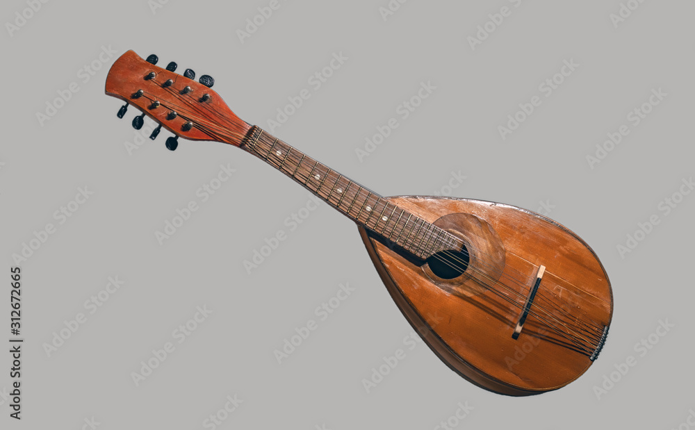 Mandolin located diagonally on a gray background. Baroque string ...