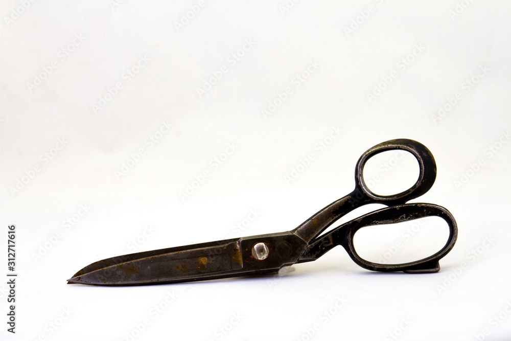 Old and warn pair of large rusted scissors isolated on a white ...