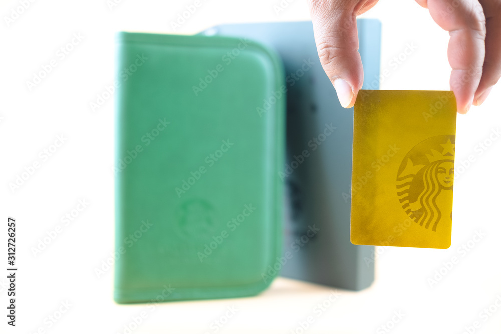 Bangkok, Thailand - January 1, 2020 : Hand holding member level gold ...