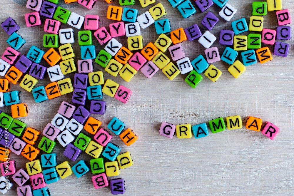 grammar, learn language concept, word made from multicolored letters ...