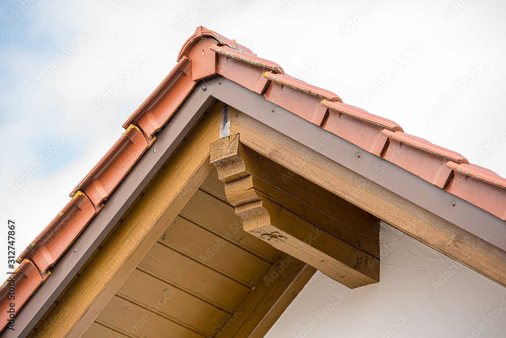 Small gable at the front facade. Roof covered with red tiles. Stock ...