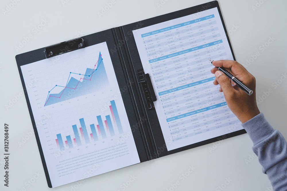 businessman working calculate data document graph chart report ...