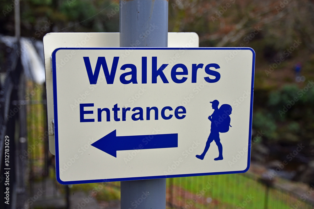 Walkers entrance sign with arrow and symbol of hiker with rucksack ...