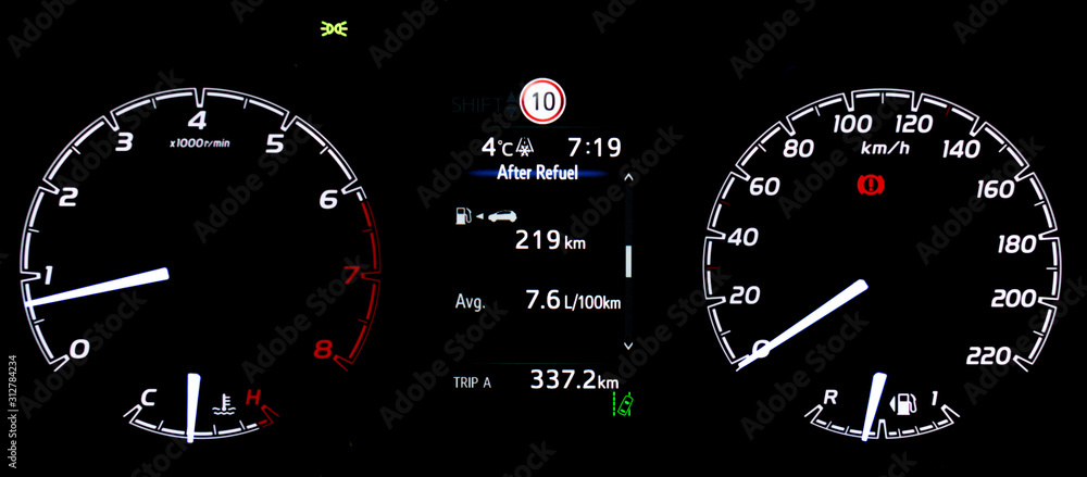 Average fuel economy consumption display between circular speedometer ...