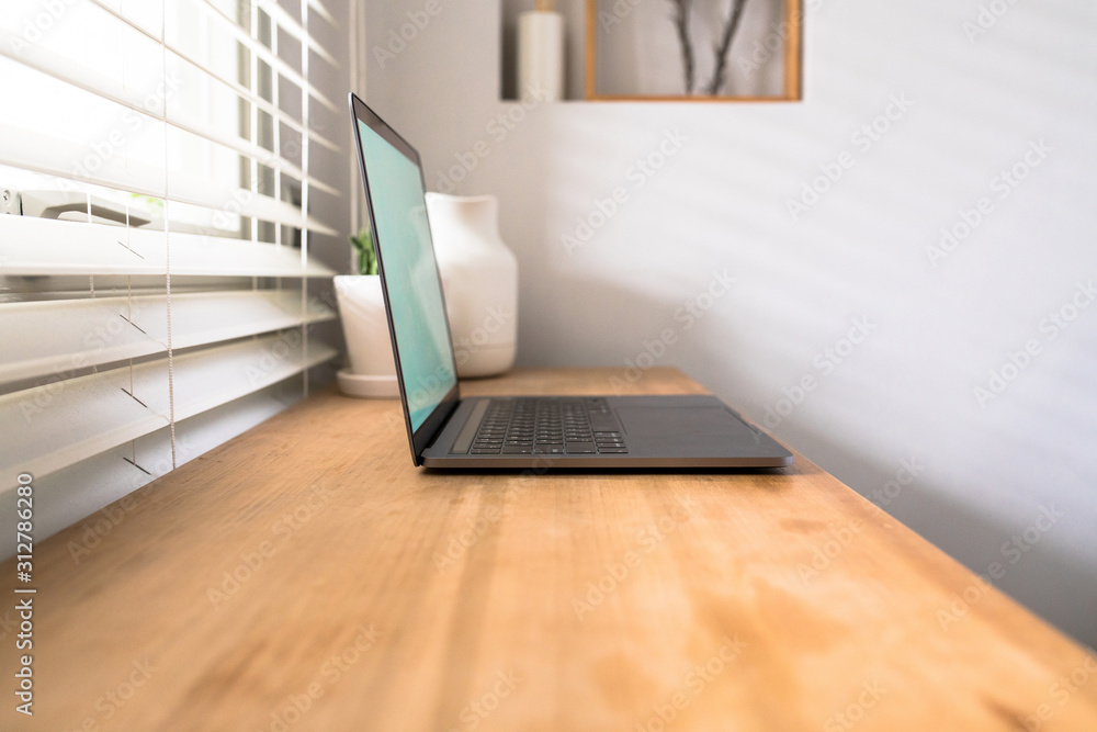 Workplace near the window with laptop and computer. Copy space. use in ...