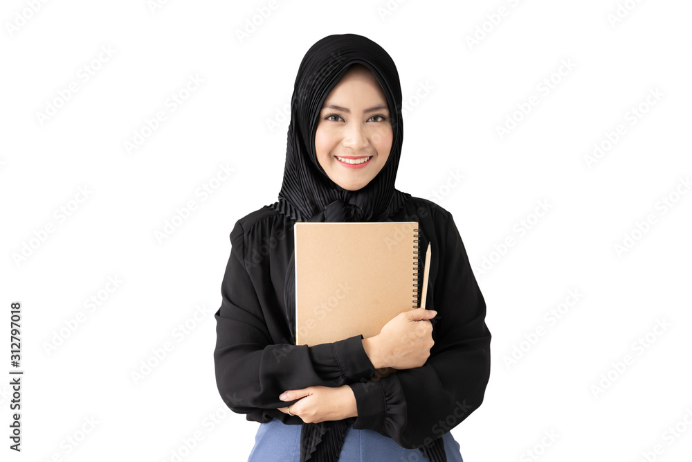 Portrait of beautiful Asian muslim student holding a book and pencile ...