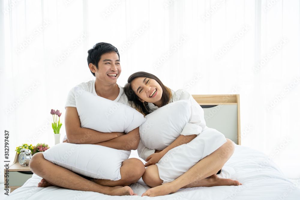 Happy Asian couple staying together in the bedroom. Stock Photo | Adobe ...