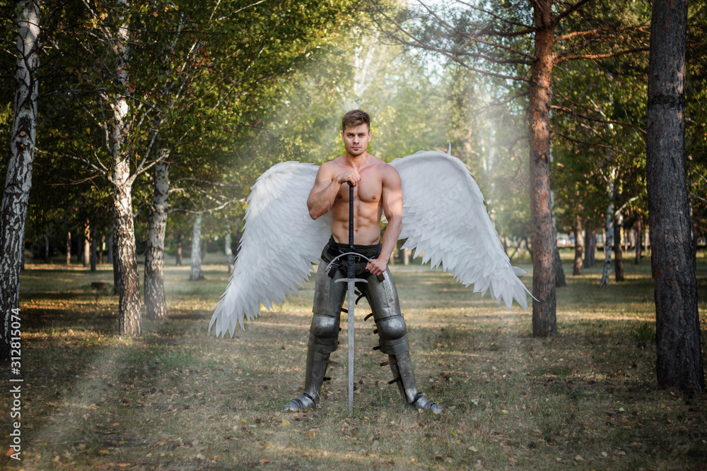 Angel warrior, a bodybuilder in plate armor on his legs with wings ...