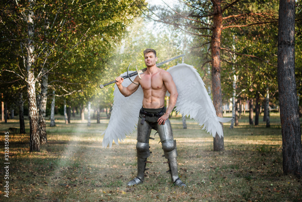 Angel warrior, a bodybuilder in plate armor on his legs with wings ...