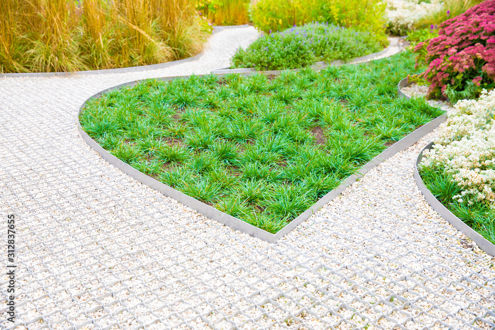 Landscape design, beautiful garden with garden embankments of white ...