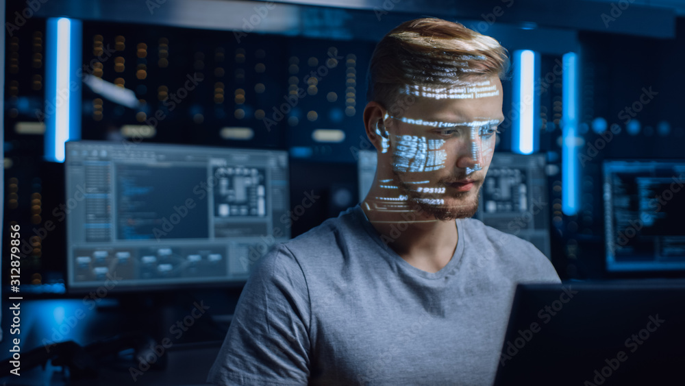 Foto de Young Software Programmer Working on Personal Computer in ...