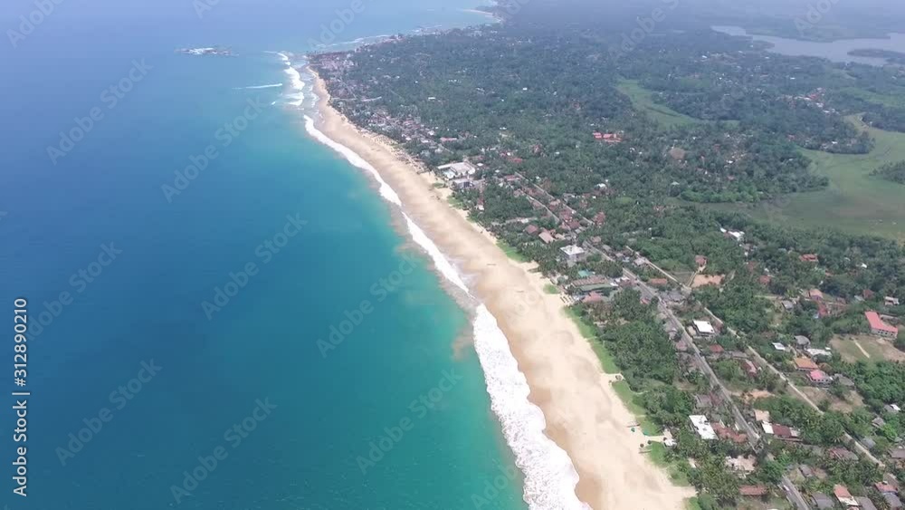 Beach and palm trees with coconuts on beach in Hikkaduwa, Sri Lanka ...
