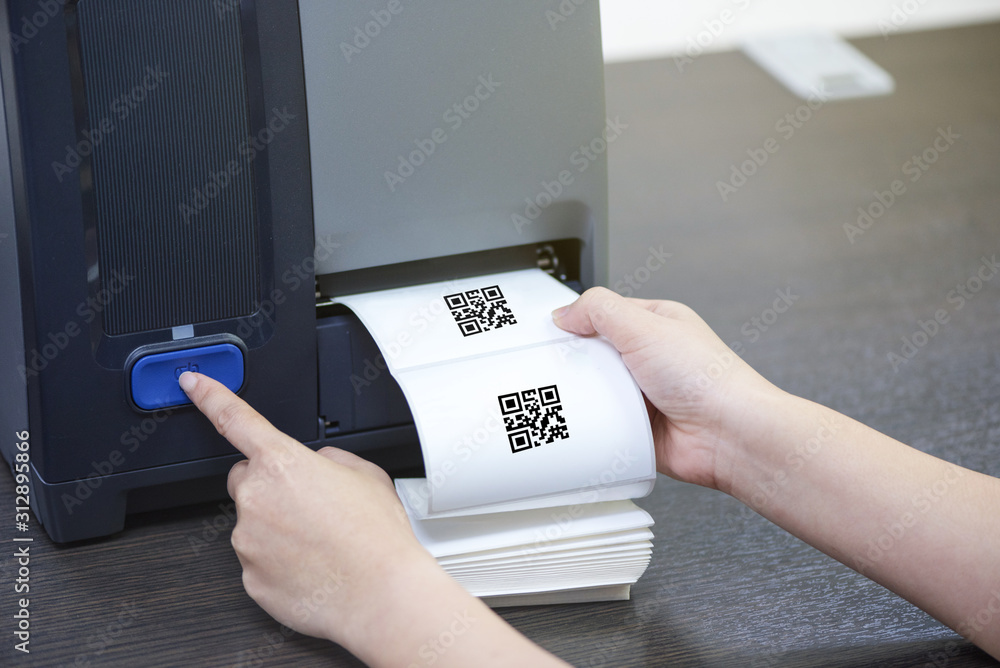 Hand and barcode label printer. Printing Barcode Stock Photo | Adobe Stock