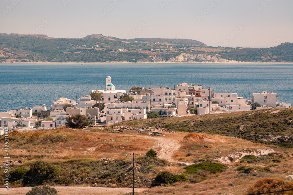 View on the seaside main port and near islands at Milos, Greece at ...